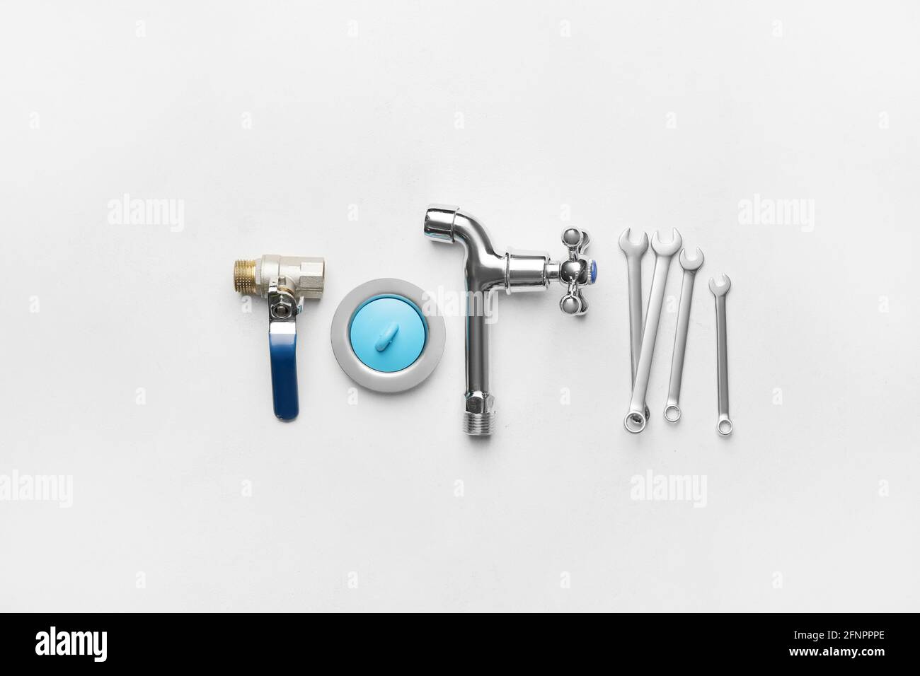 Set of plumber's items on light background Stock Photo - Alamy
