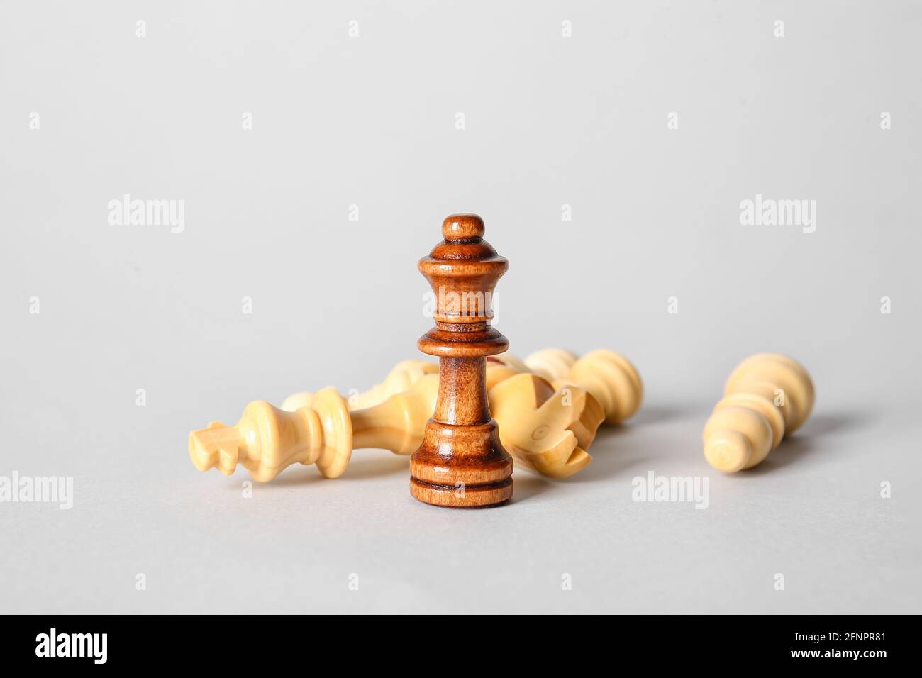 Chess pieces on light background Stock Photo - Alamy