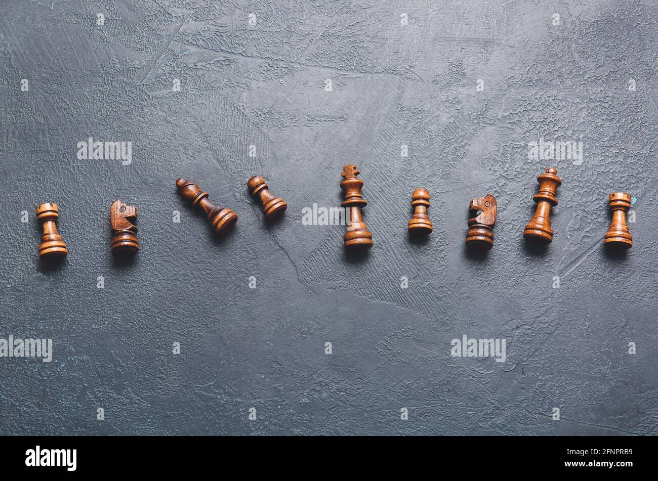 Wooden chess pieces on dark background Stock Photo - Alamy