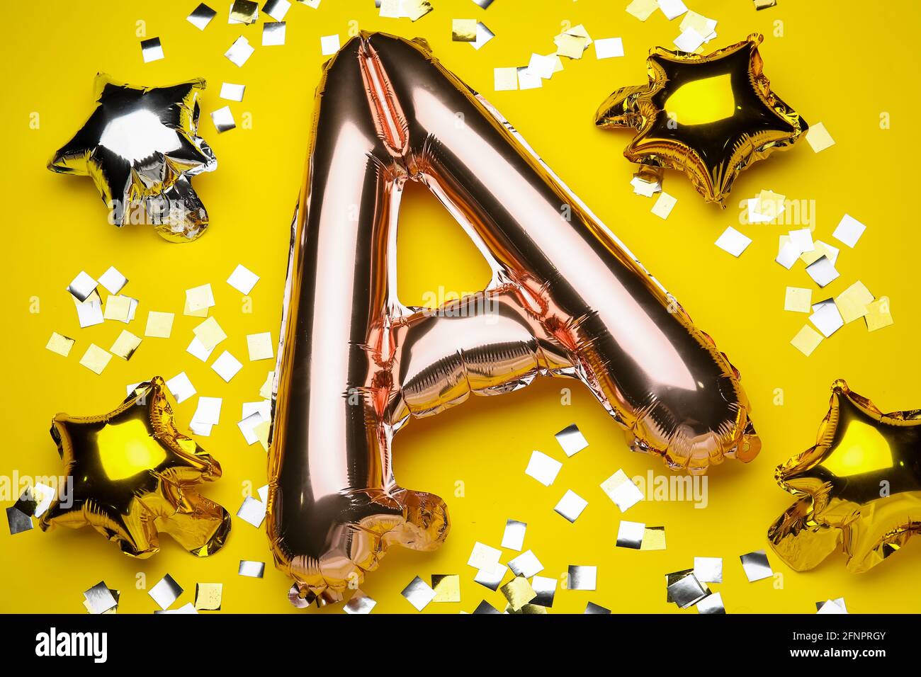 Balloon in shape of letter A on color background Stock Photo - Alamy