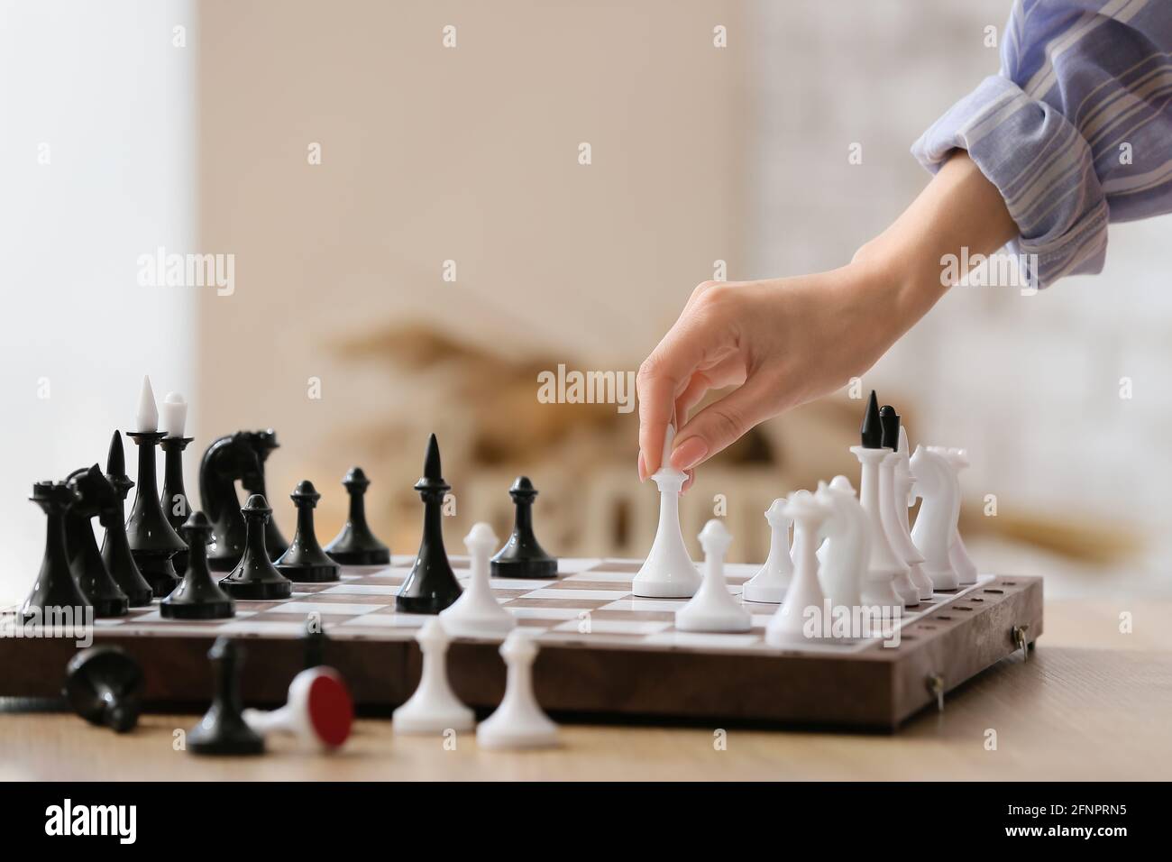 Chessboard hand person blurred hi-res stock photography and images - Alamy