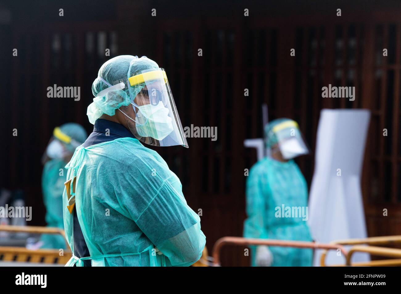 Medical staff wearing a Personal Protective Equipment suite (PPE) seen ...
