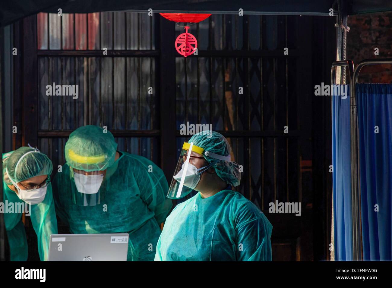 Medical staff wearing Personal Protective Equipment suites (PPE) seen ...