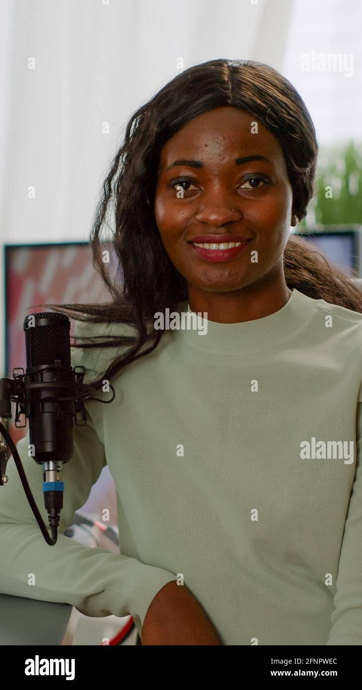Portrait of excited african professional streamer player looking at ...