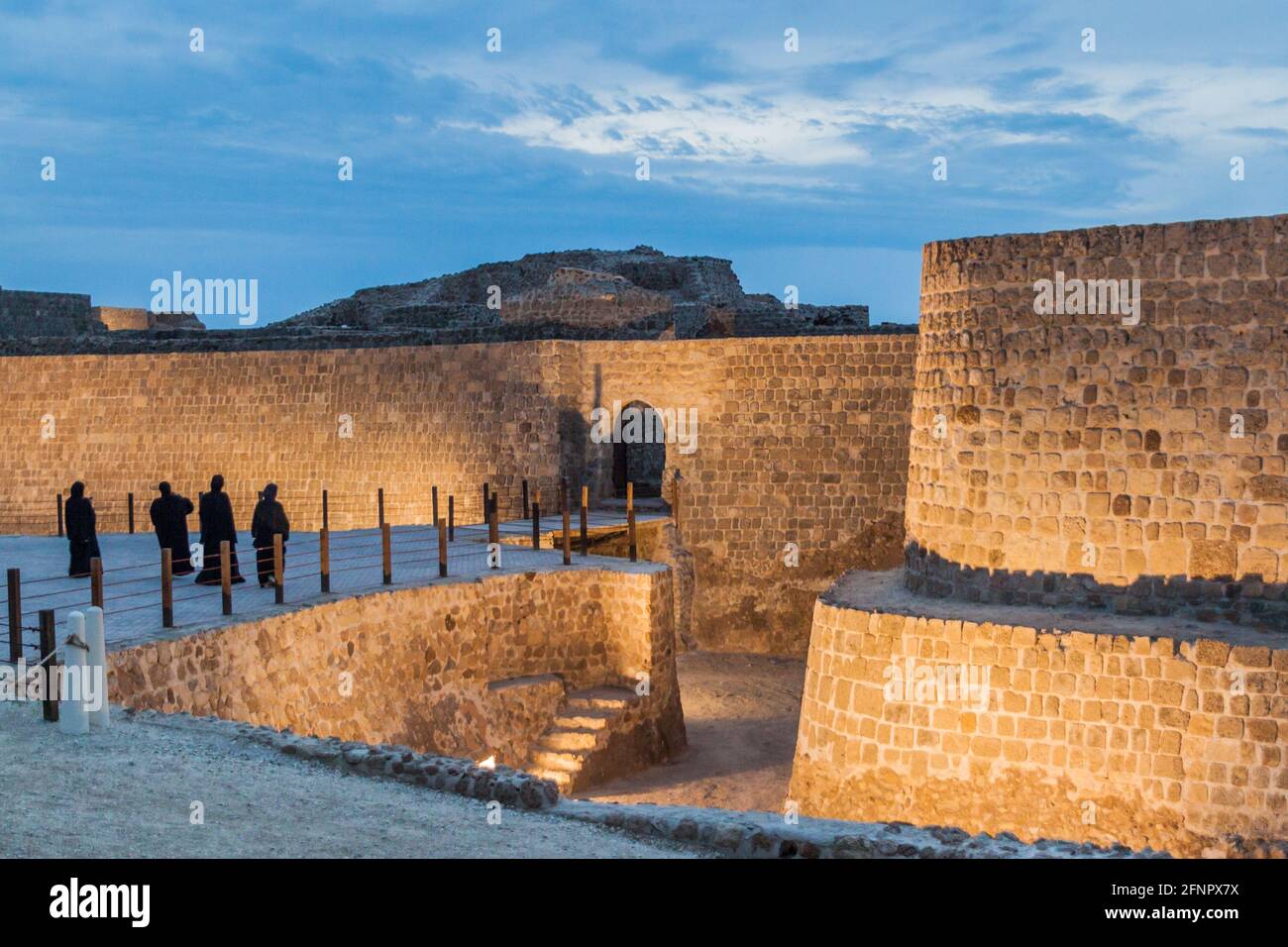 Local women visit Bahrain Fort Qal'at al-Bahrain in Bahrain Stock Photo ...