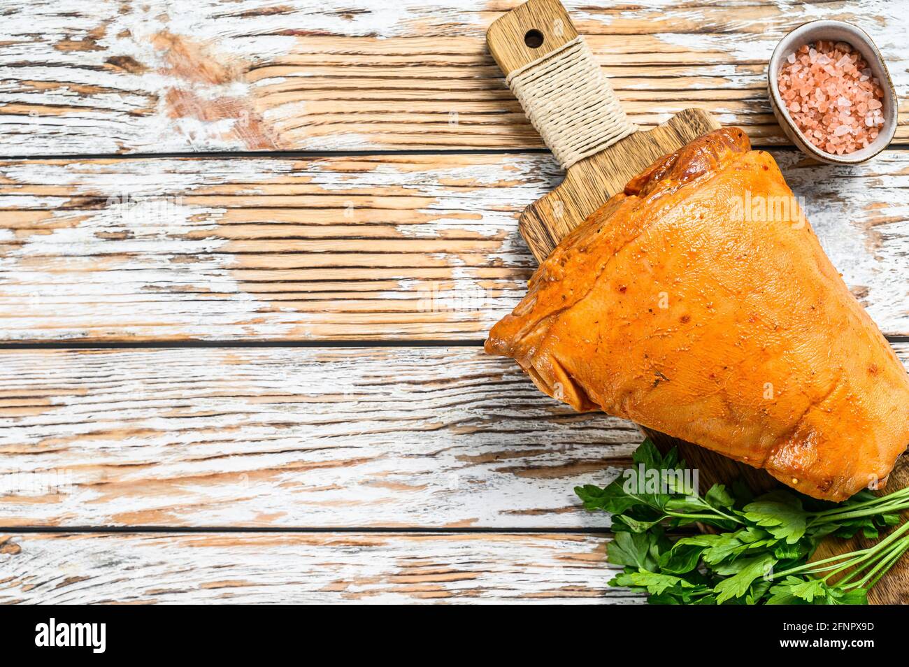 Raw fat pork knee ready for cooking. White background. Top view. Copy ...