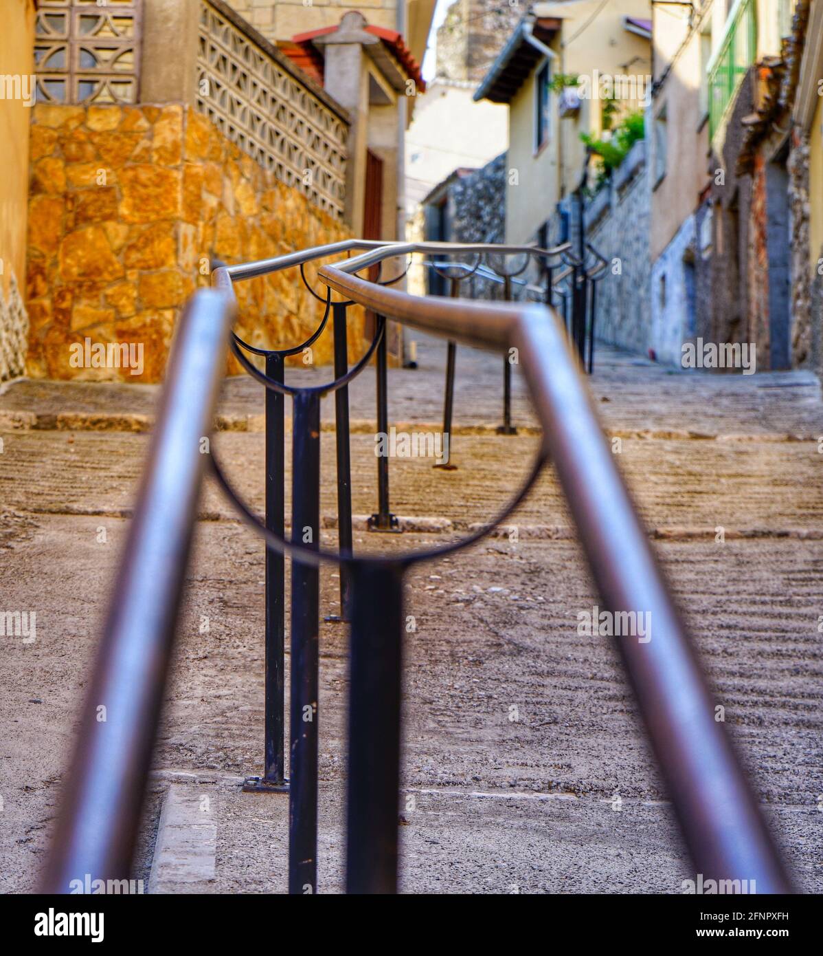 Metal handrails on the stairs of a step street Stock Photo - Alamy
