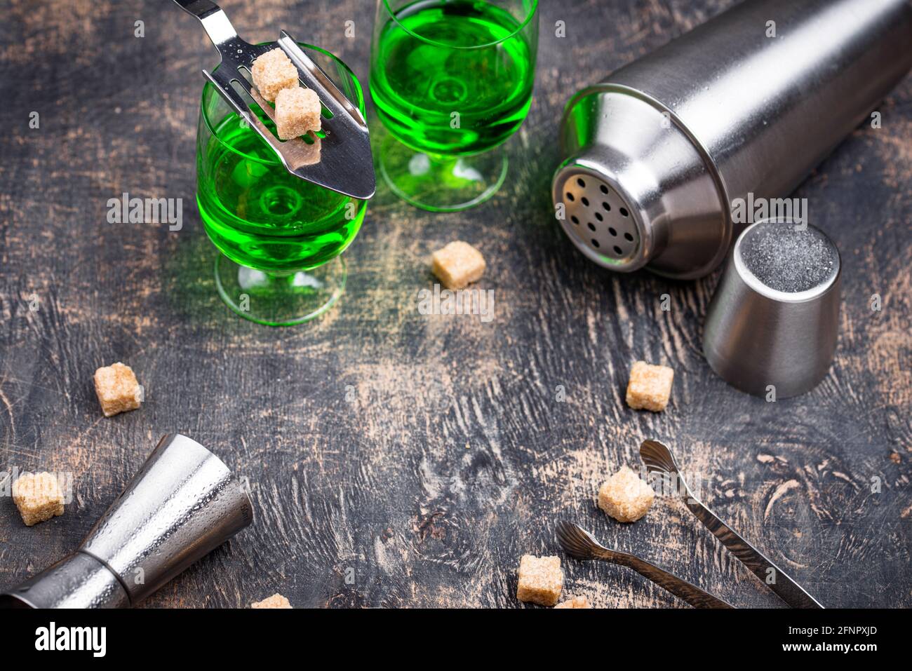 Glass of absinthe with cane sugar Stock Photo - Alamy
