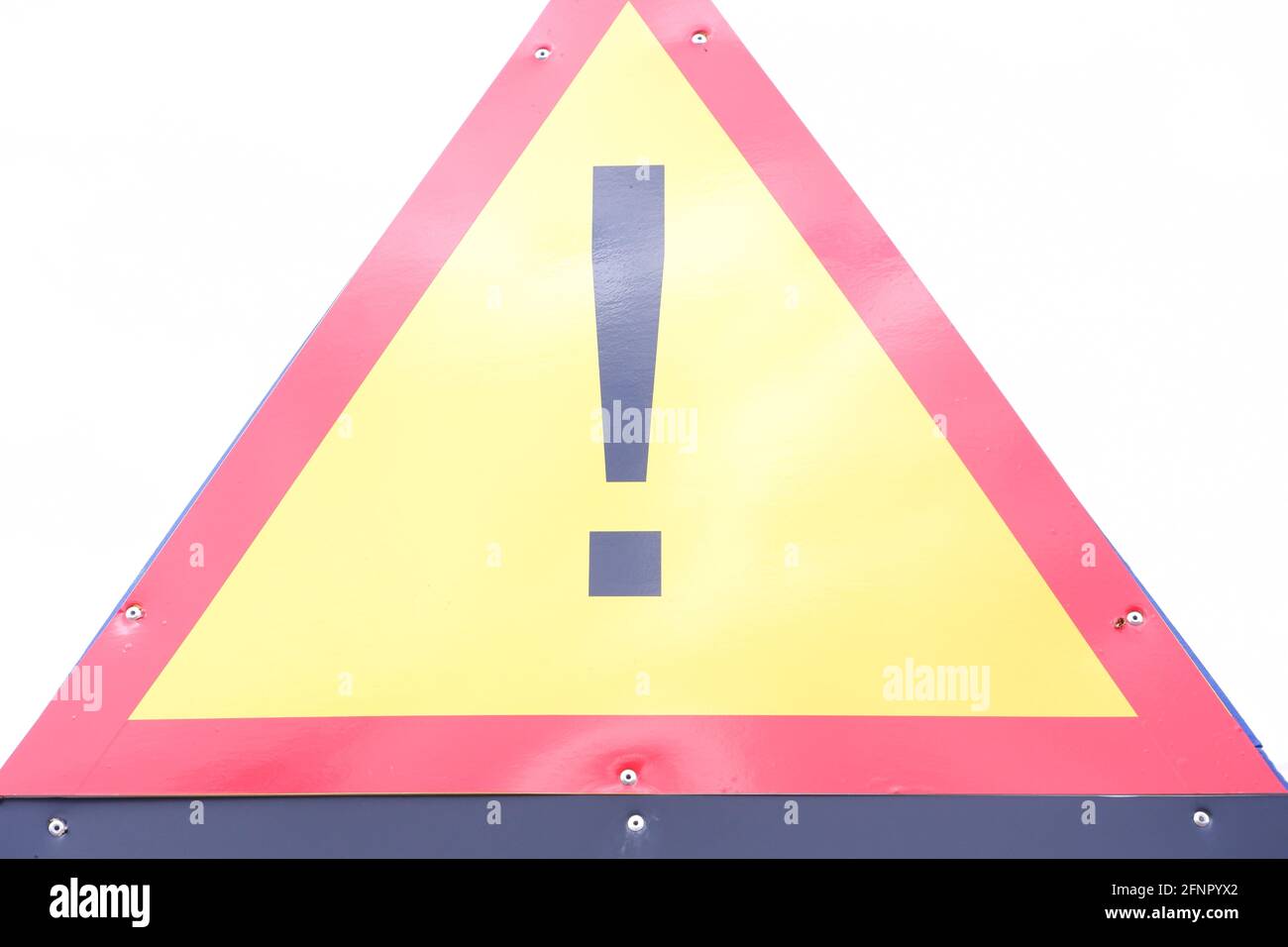 Warning triangular red and yellow hazard sign, taken outside and ...