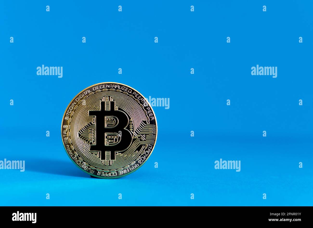 Bitcoin BTC crypto currency gold coin on blue background, new virtual ...