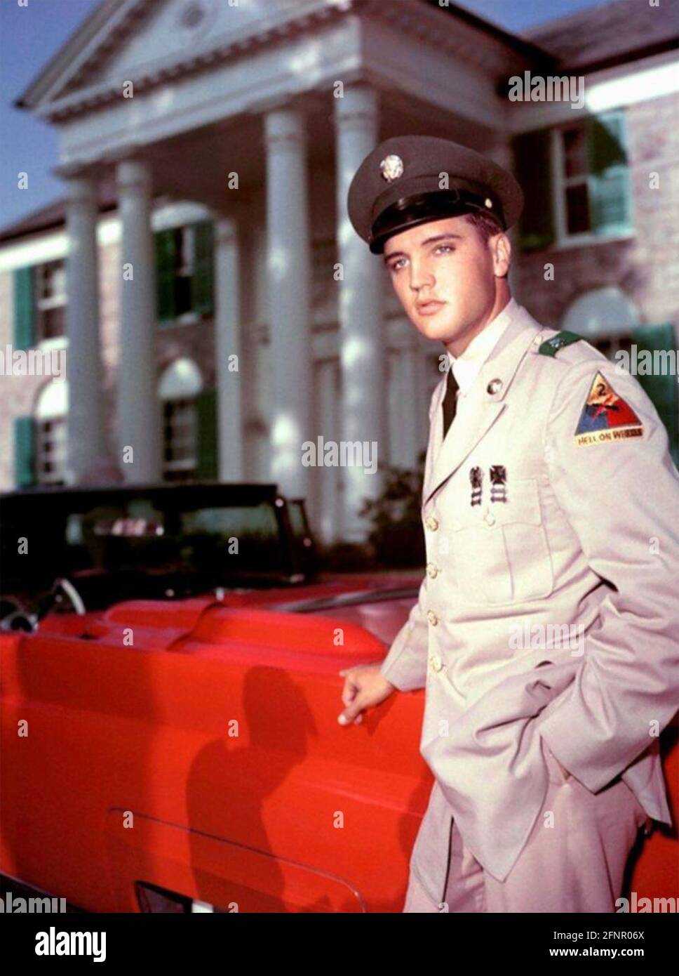 ELVIS PRESLEY (1935-1977) American singer and film actor outside ...