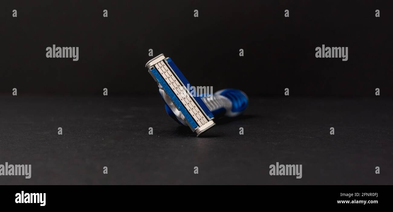 Razor close up on black background Stock Photo - Alamy