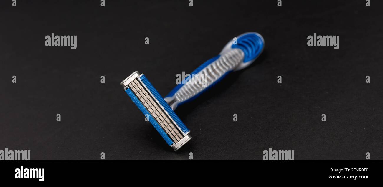 Razor close up on black background Stock Photo - Alamy