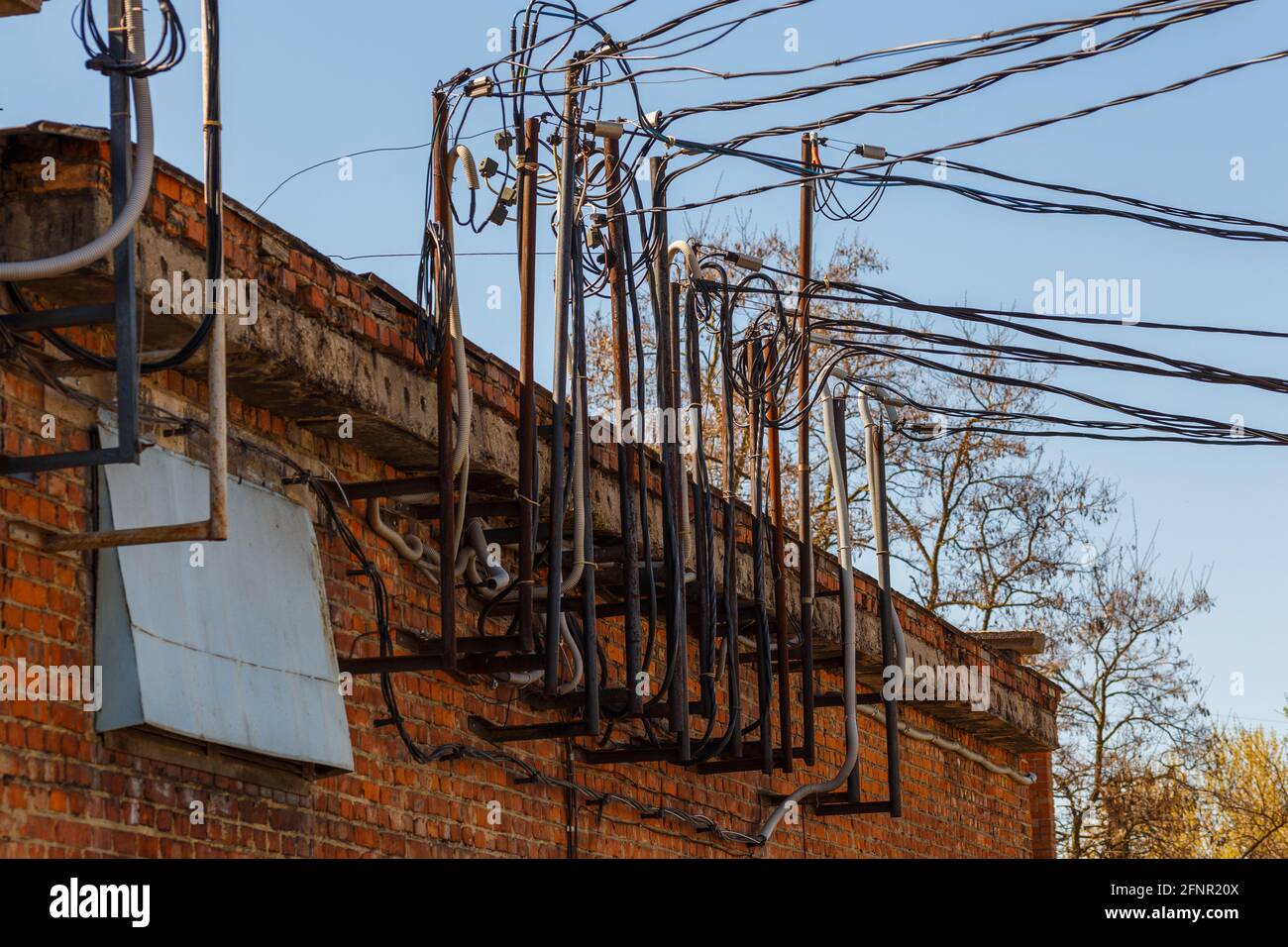 lots of wires sticking out of an old brick electrical substation ...
