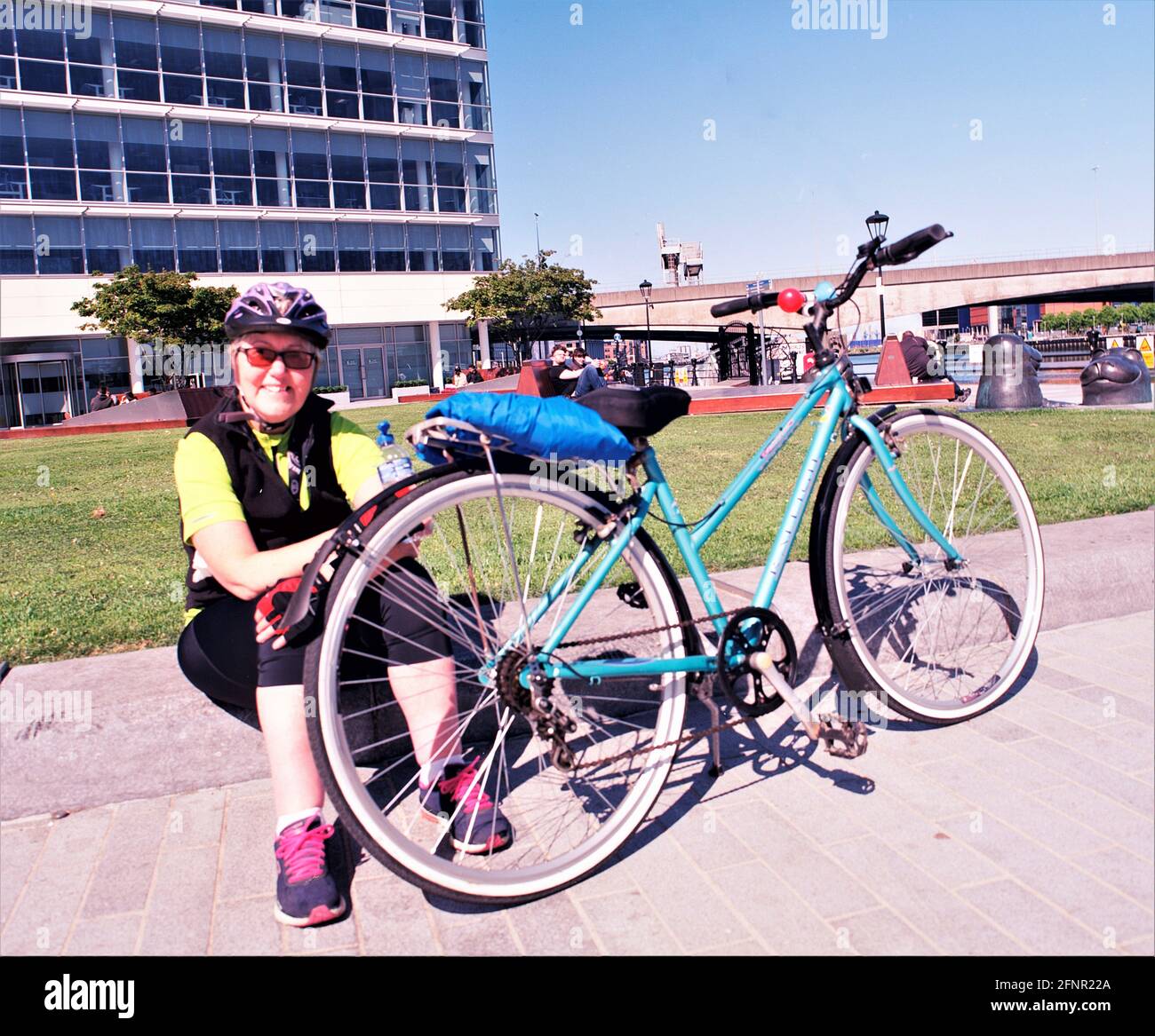 Lady and bike Belfast Laganside Medium format film street photography Stock Photo - Alamy