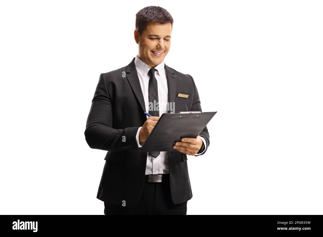 Male receptionist writing a document on a clipboard isolated on white ...