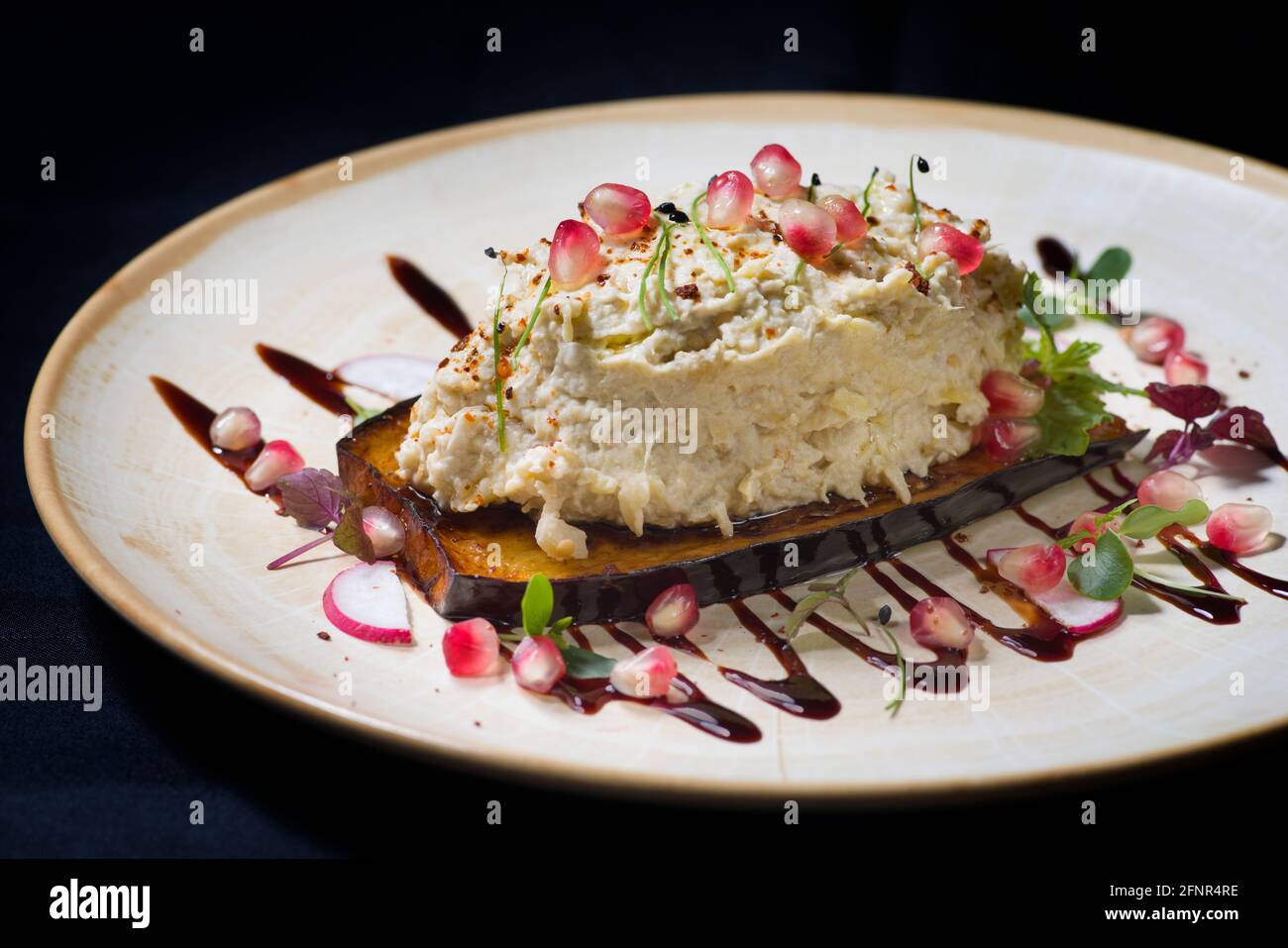 Mutabbal with pomegranate Stock Photo - Alamy