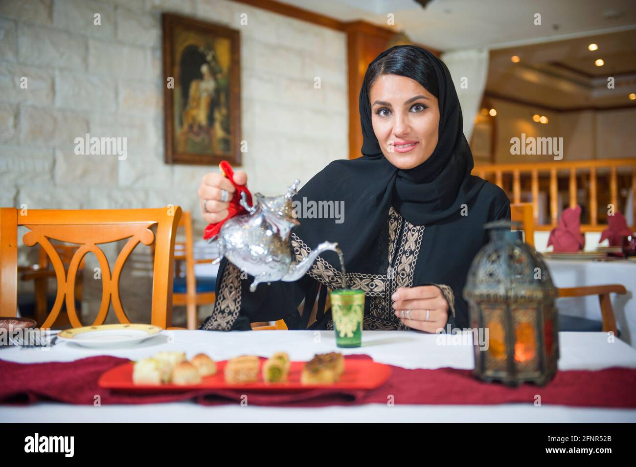 Arabic Woman Drinking Tea Stock Photo - Alamy