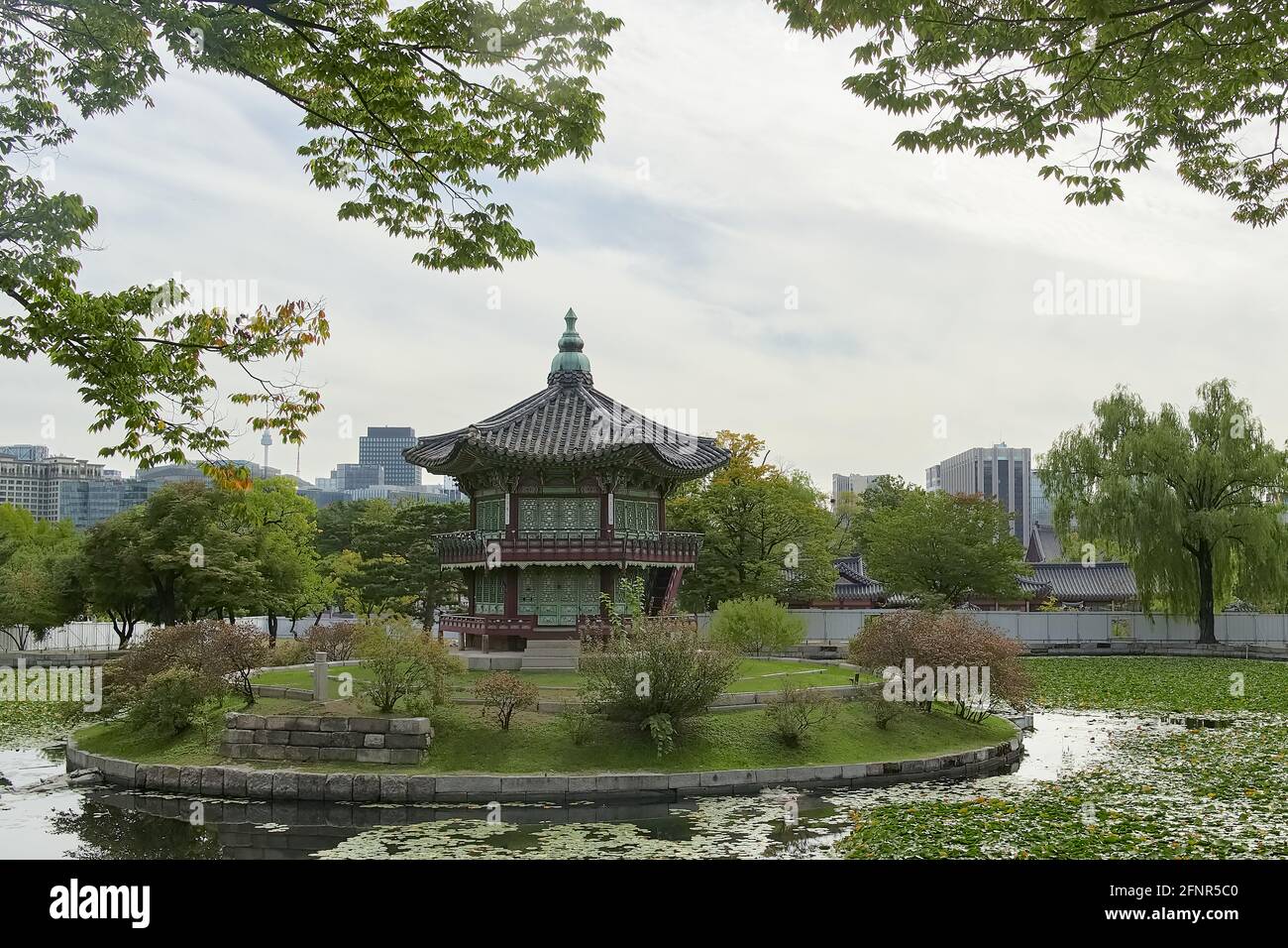 The ornately decorated Hyangwonjeong Pavilion in Gyeongbokgung Palace ...