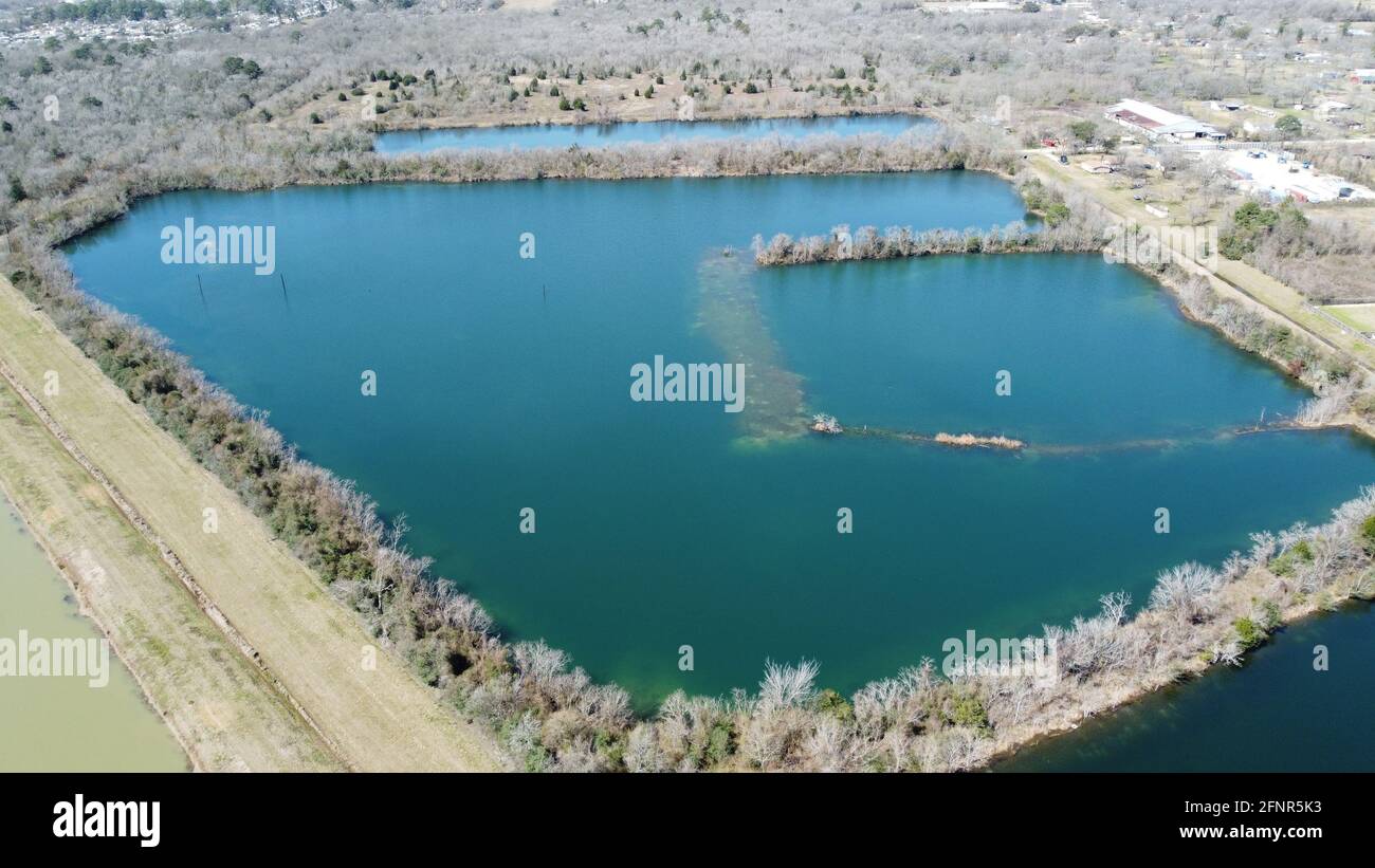Aerial photo of pond near Houston, Texas with coral island and white ...