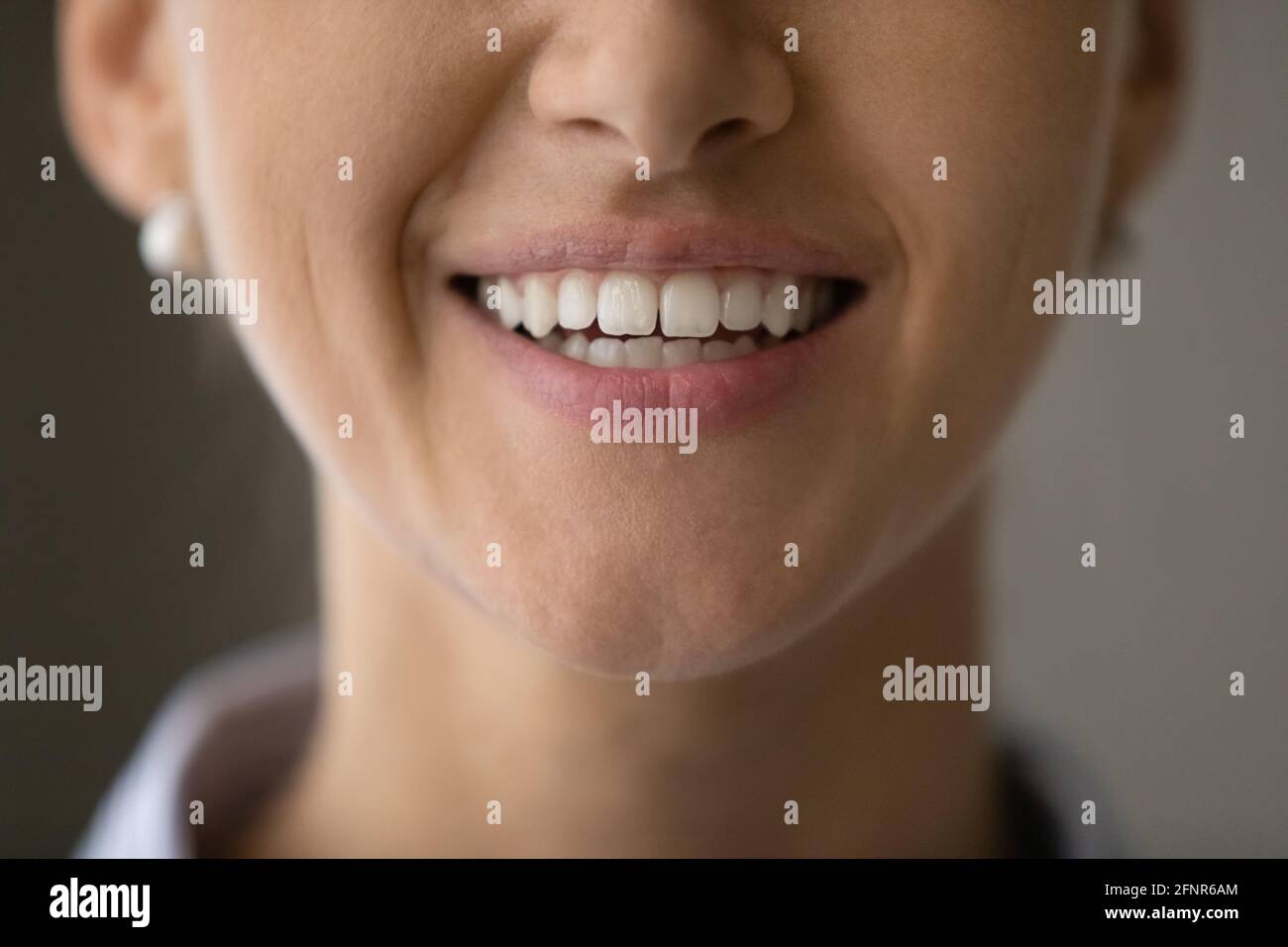 Lower part of young woman face with charming healthy smile Stock Photo ...