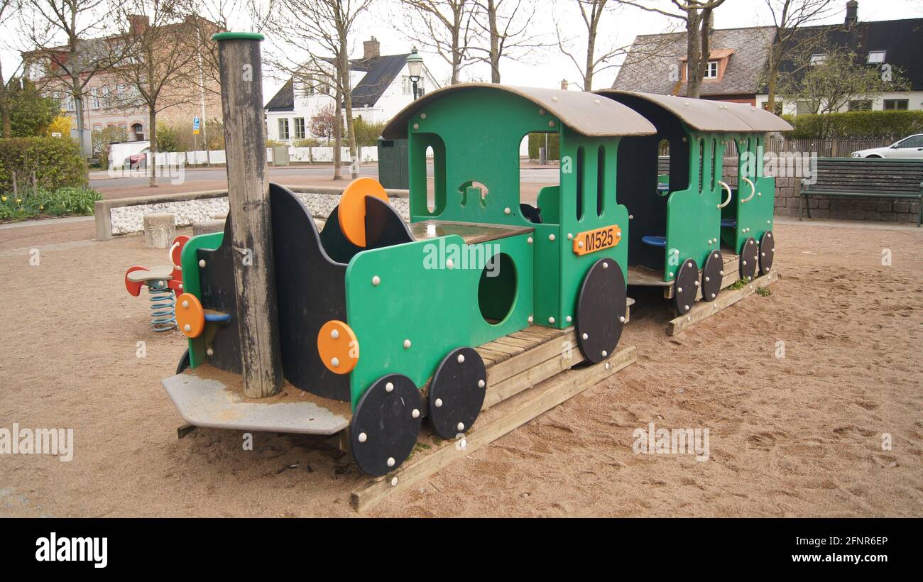 Green children's train in a playground for kids to play inside Stock ...