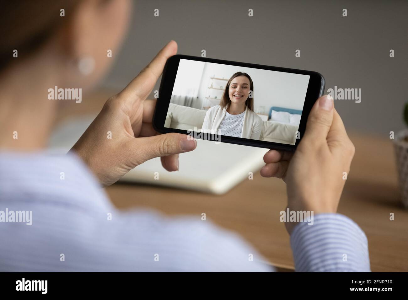 Phone screen view smiling female teenager talking by video call Stock ...