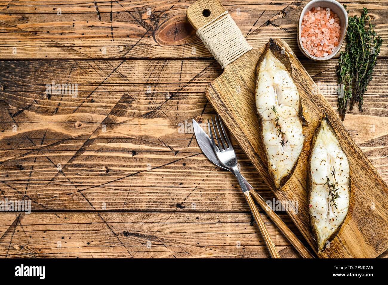 Baked halibut fish steak. wooden background. Top view. Copy space Stock ...