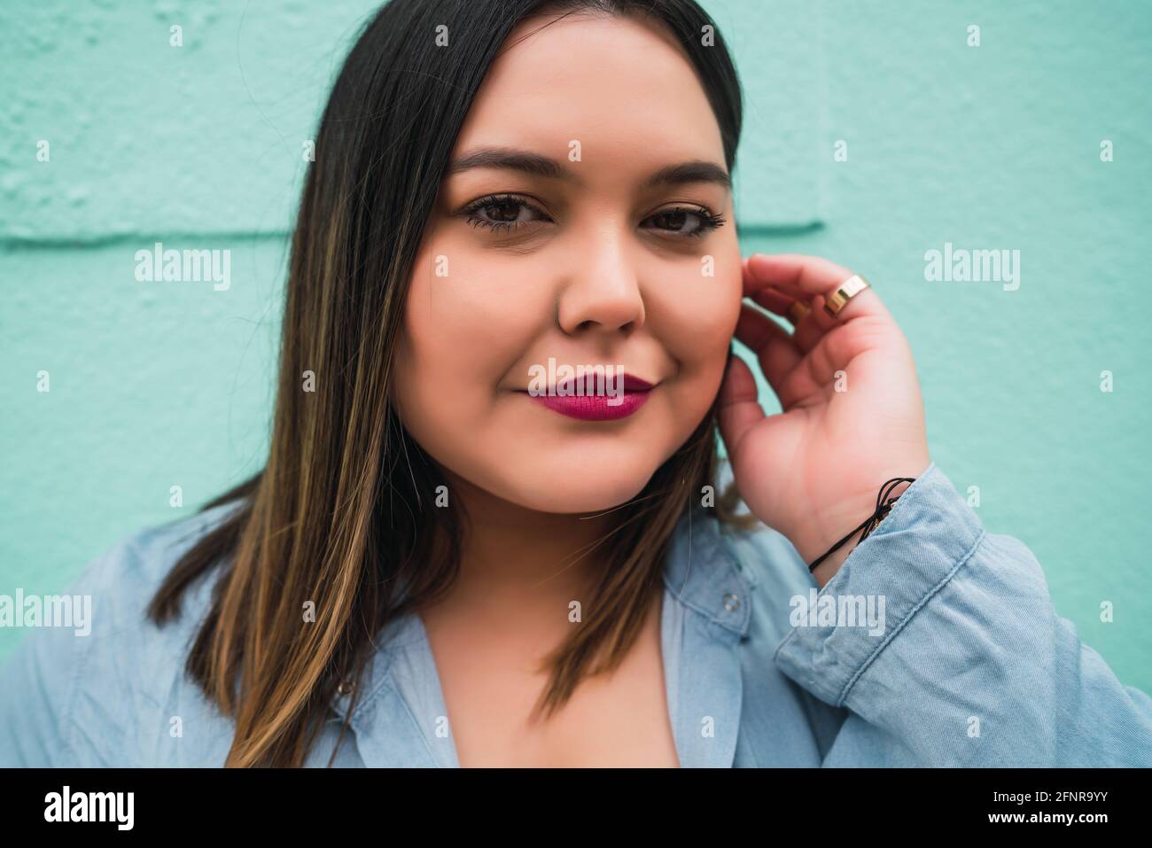 Portrait of young plus size woman Stock Photo - Alamy