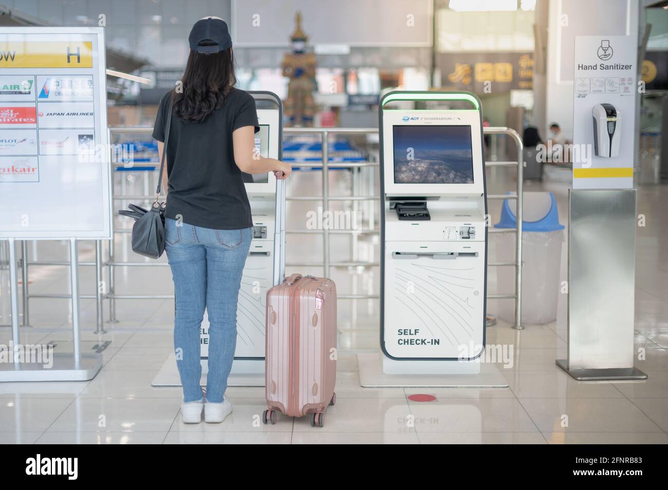BANGKOK THAILAND APR 14 2021 Female hand using the auto self service ...