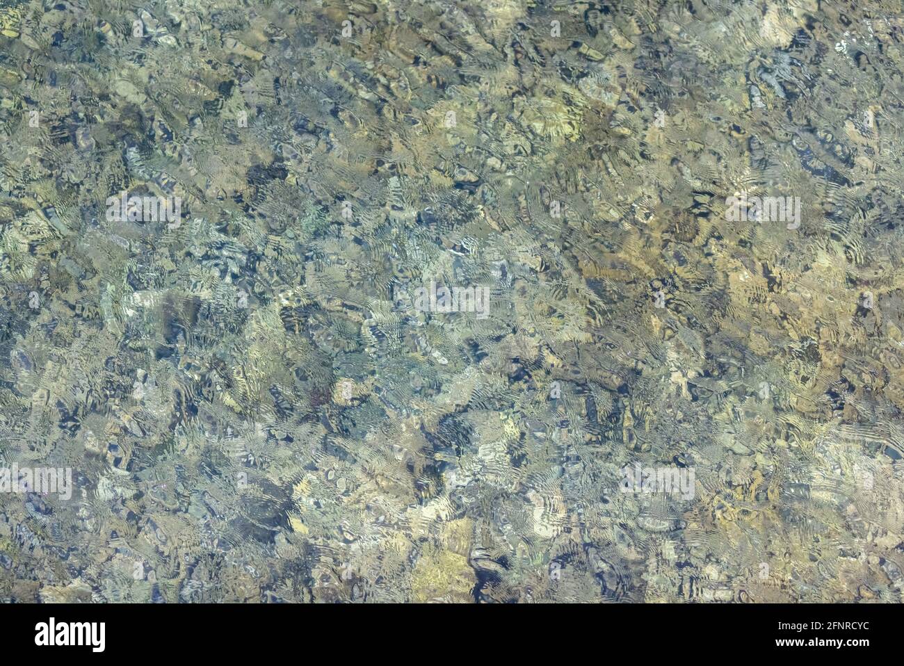 rocks distorted below the surface of water Stock Photo - Alamy