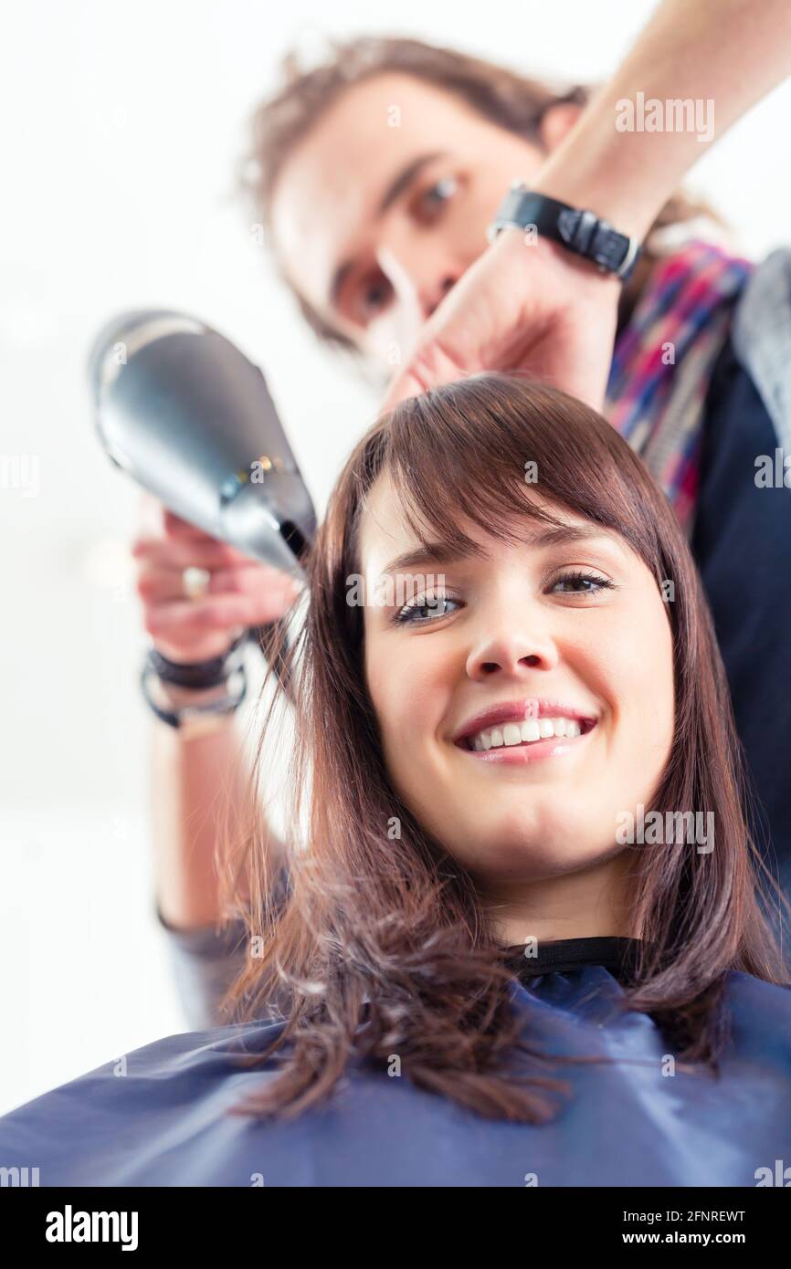 Professional hairdresser woman blow dry hi-res stock photography and ...