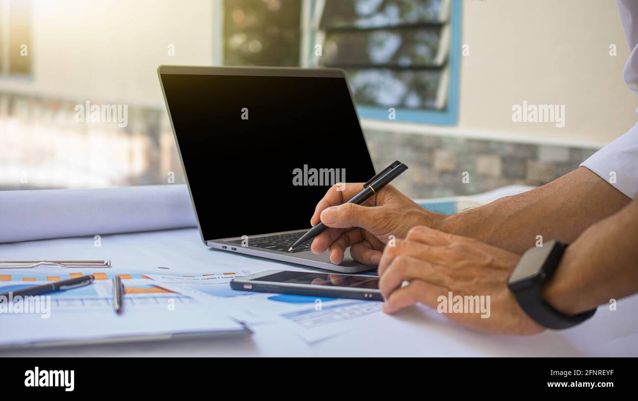 Hand hold pen working on desk in office, businesspeople work report ...