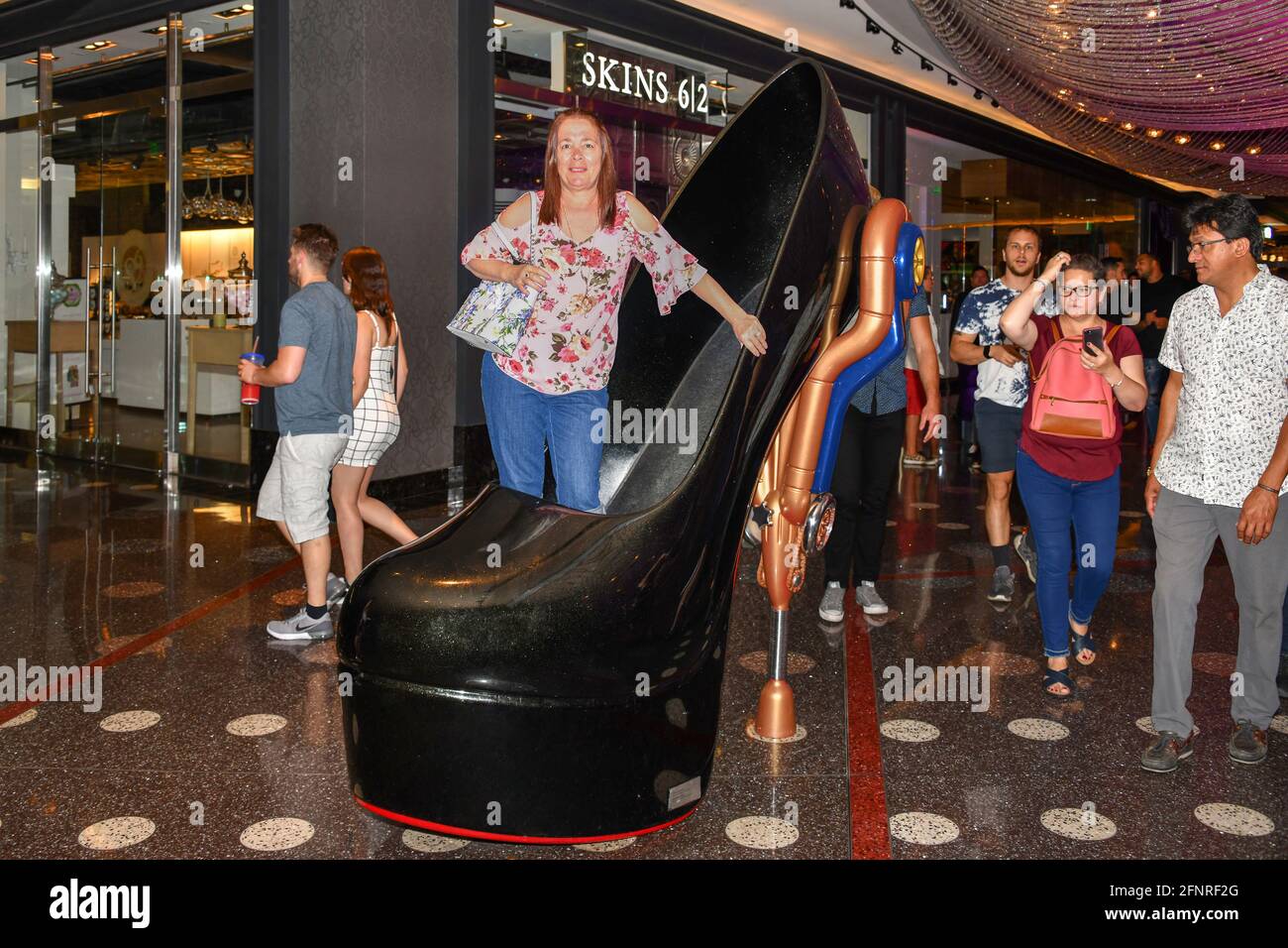 Nevada USA, 09-30-18 A beautiful lady poses for a photo on a giant high ...