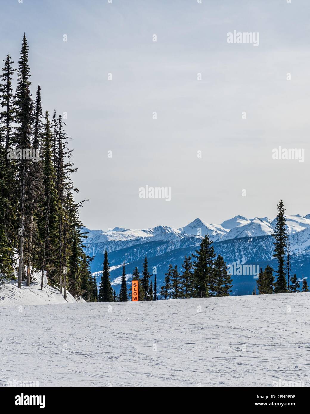 ski resort trail covered in snow and slow sign revelstoke british ...