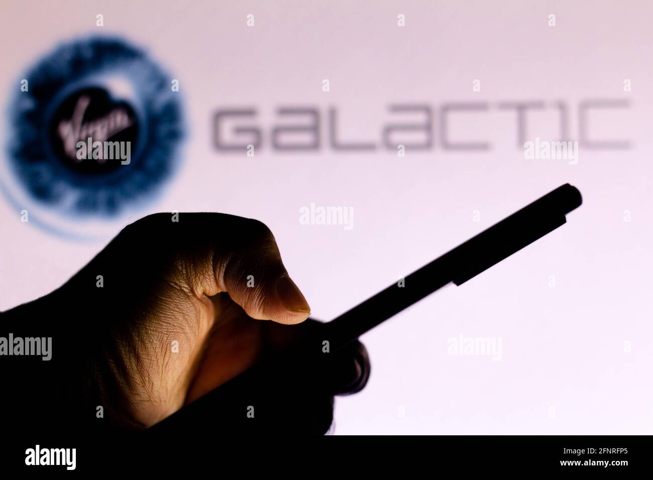 Brazil. 13th May, 2021. In this photo illustration the Virgin Galactic ...