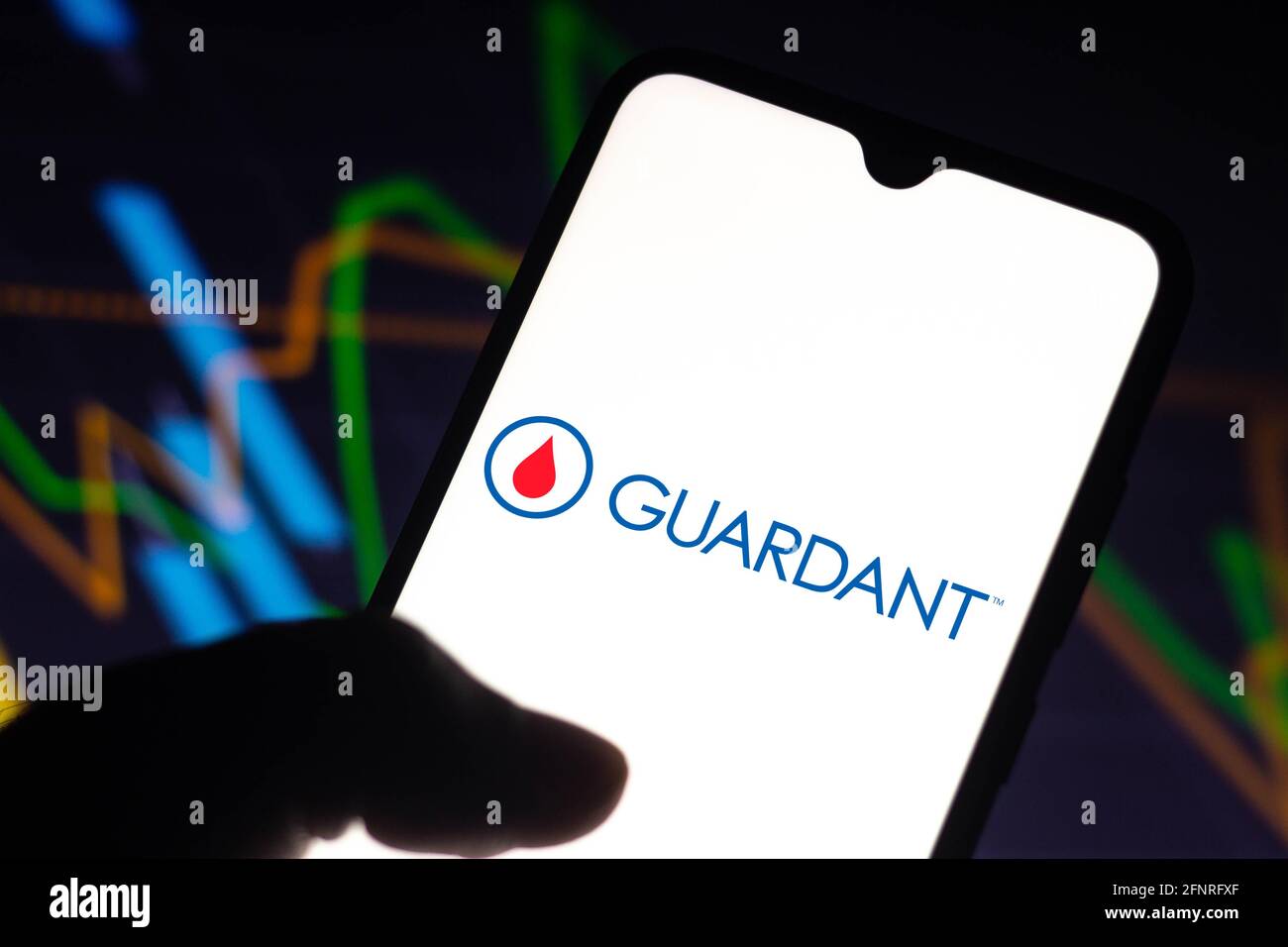 In this photo illustration the Guardant Health logo seen displayed on a ...