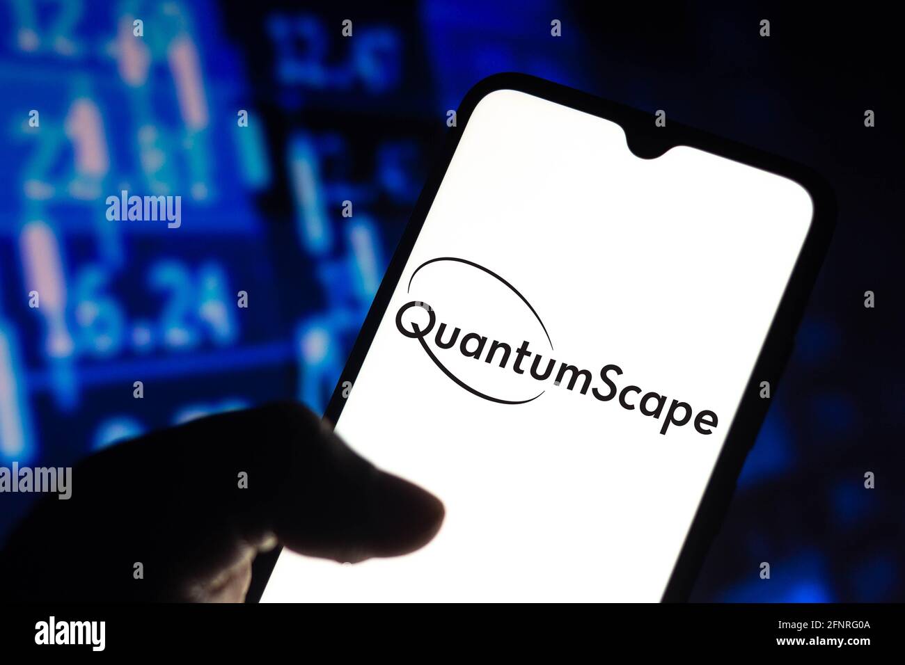 In this photo illustration the QuantumScape logo seen displayed on a ...