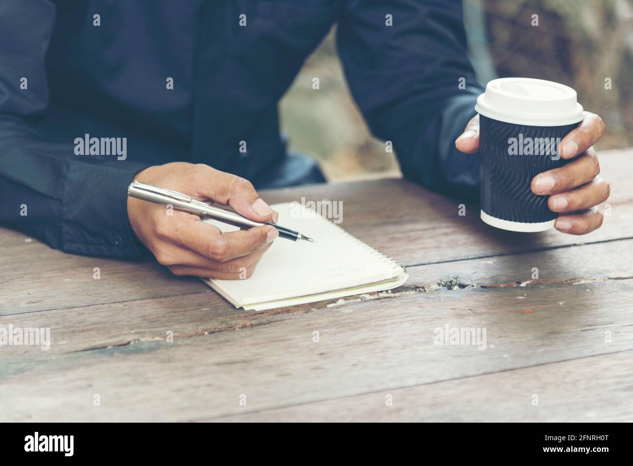 Man writing on paper hi-res stock photography and images - Alamy