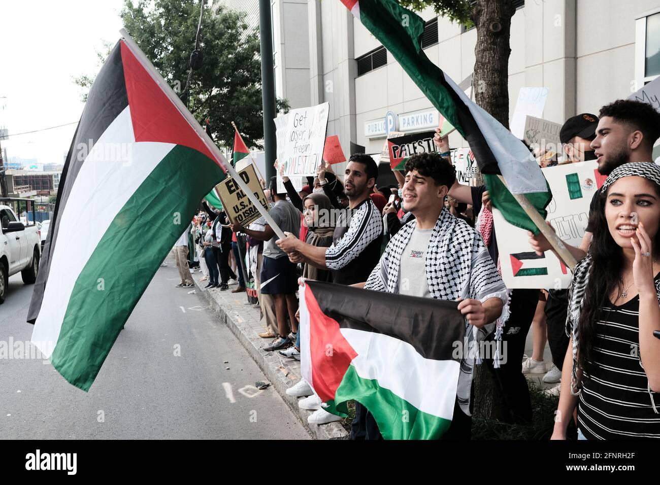 Atlanta, Georgia, USA. 18th May, 2021. A crowd of protesters hold a ...
