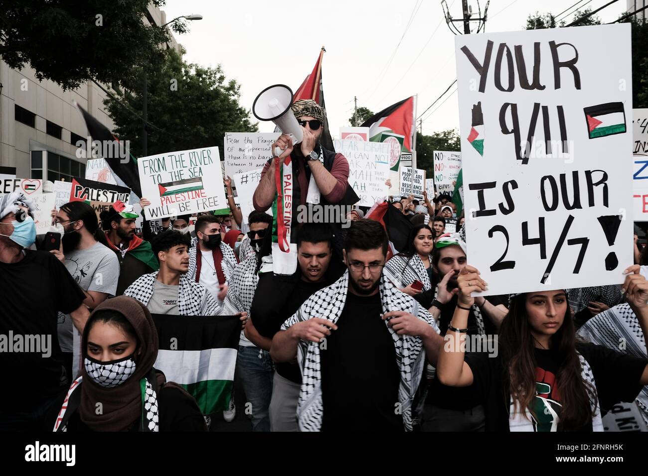 Atlanta, Georgia, USA. 18th May, 2021. A crowd of protesters hold a ...