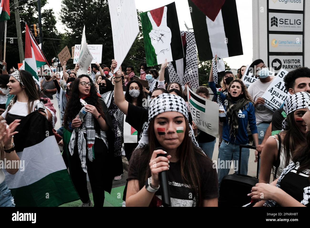 Atlanta, Georgia, USA. 18th May, 2021. A crowd of protesters hold a ...