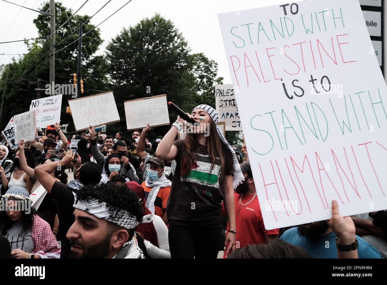 Atlanta, Georgia, USA. 18th May, 2021. A crowd of protesters hold a ...