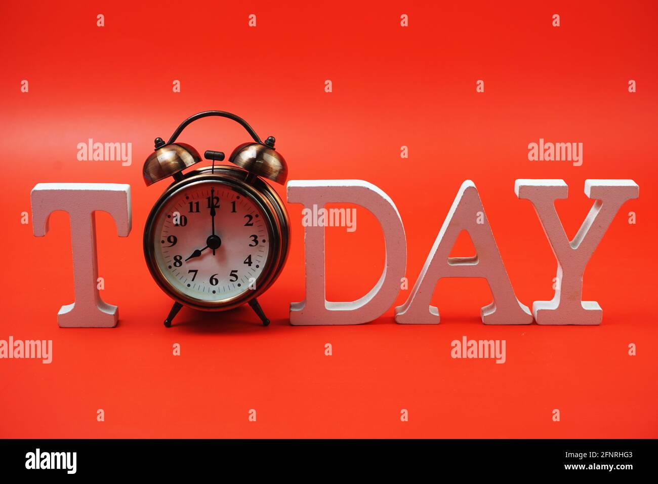 Today alphabet letters with alarm clock on red background Stock Photo ...