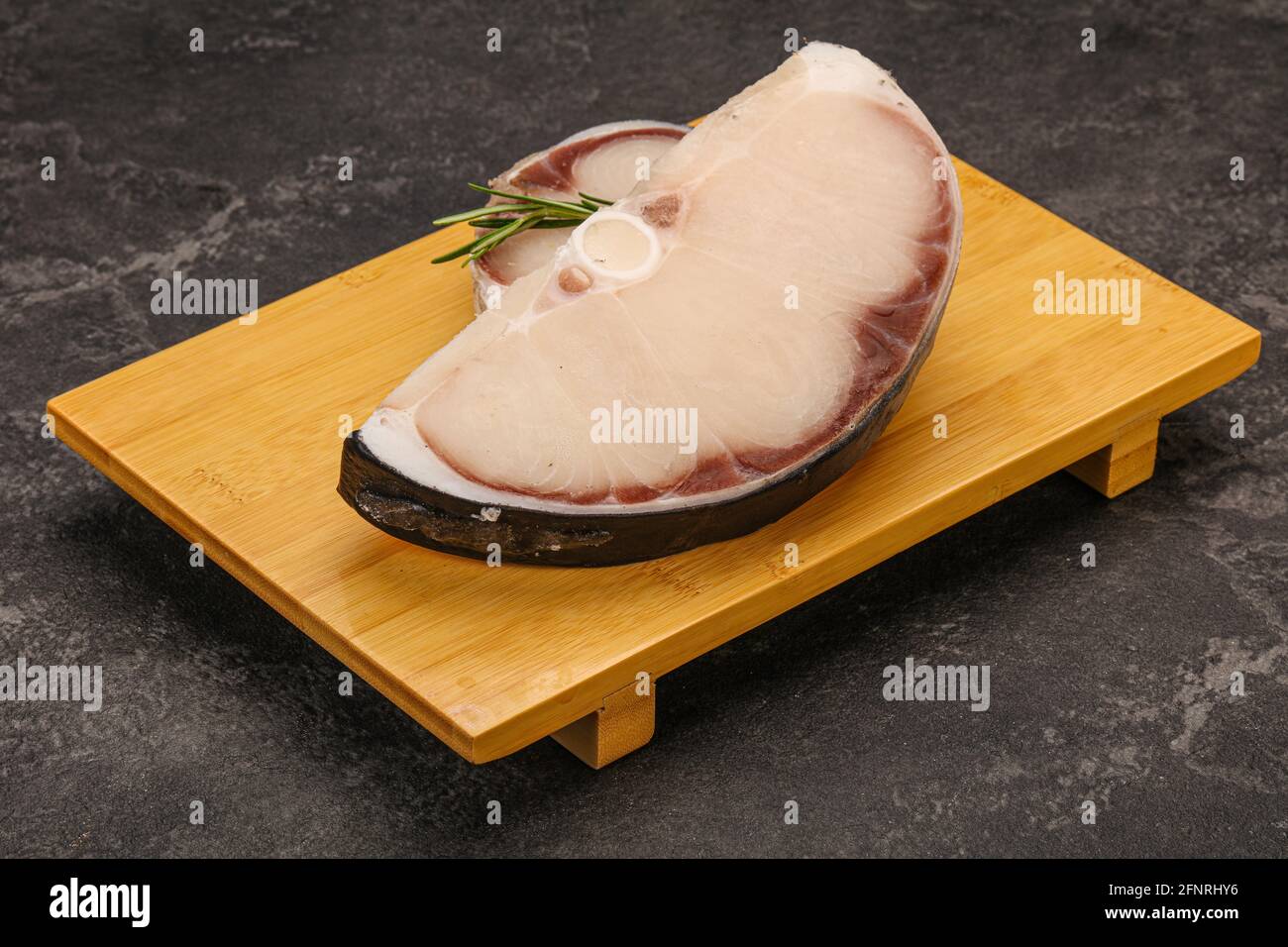 Raw shark steak served rosemary for cooking Stock Photo - Alamy