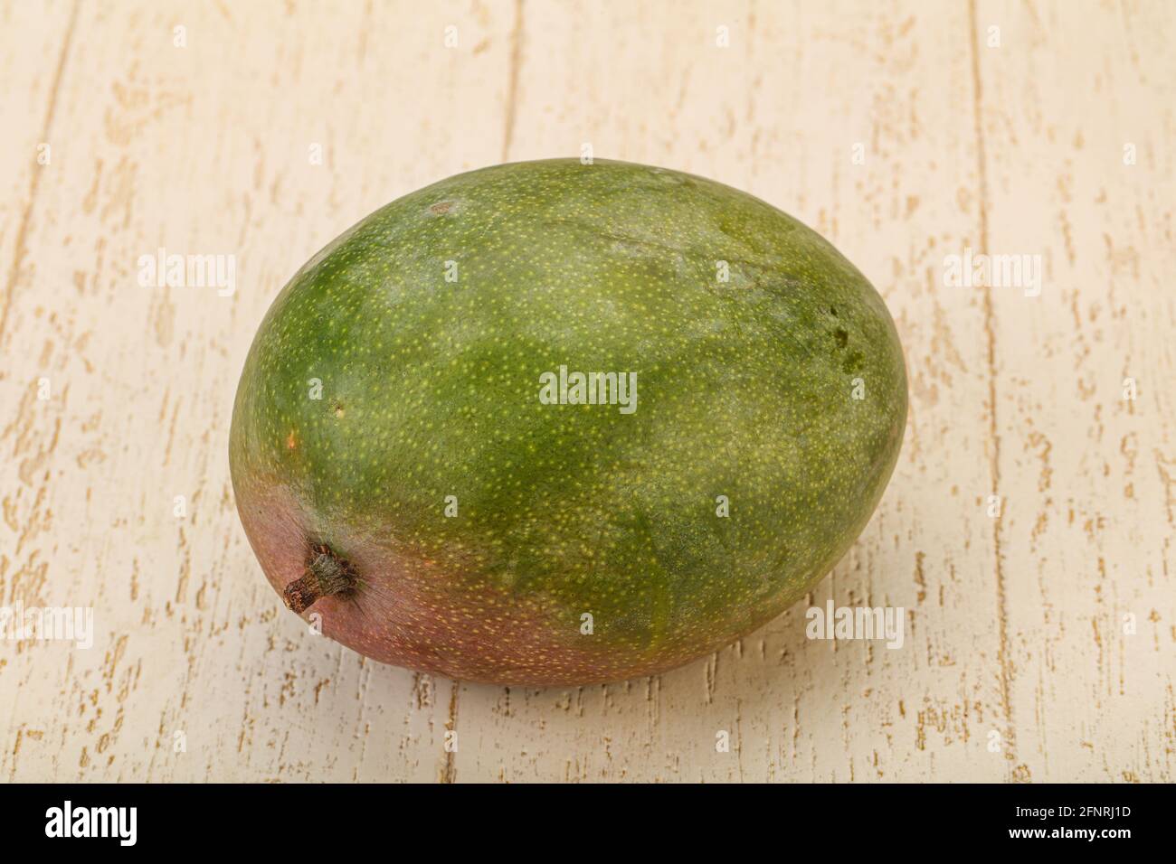 Tropical fruit - Green sweet tasty mango Stock Photo - Alamy