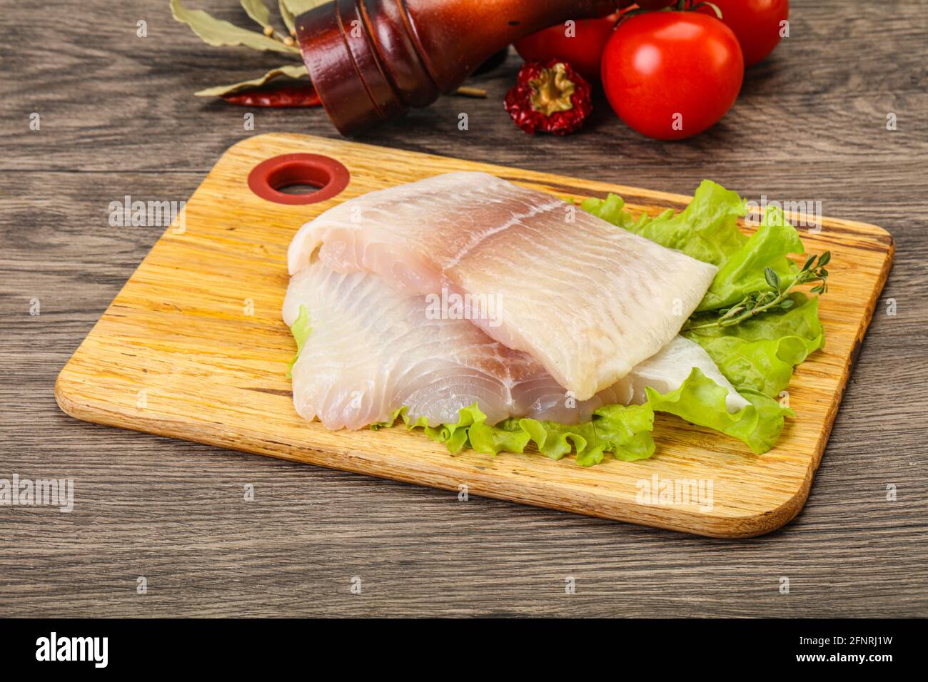 Raw pangasius fillet fish for cooking Stock Photo - Alamy