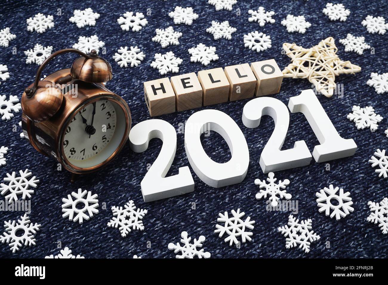 Hello 2021 alphabet letter decorate with alarm clock on blue knitted fabric background Stock ...