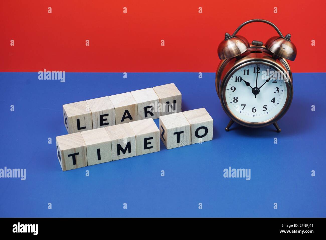 Time to Learn alphabet letter with alarm clock on blue and red ...