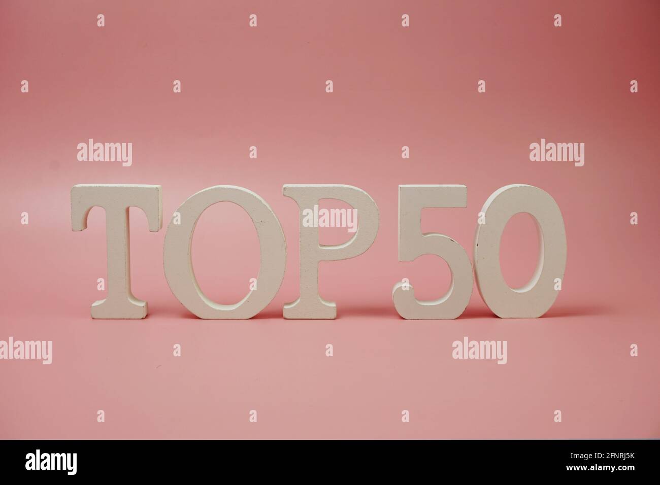 Top 50 word alphabet letters on pink background Stock Photo - Alamy